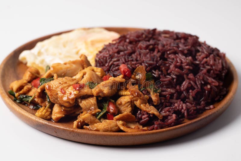 Chicken Basil with Fried Egg and Riceberry Rice Stock Photo - Image of ...