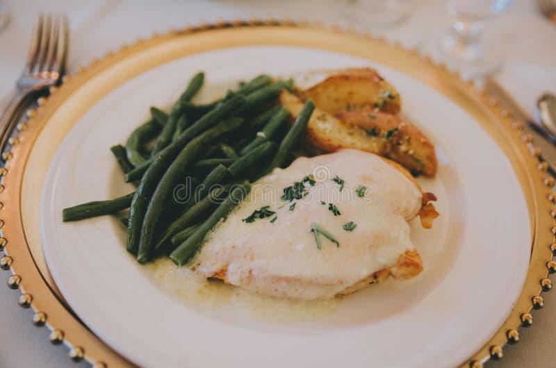 Chicken meal at a wedding stock image. Image of dish - 167454775