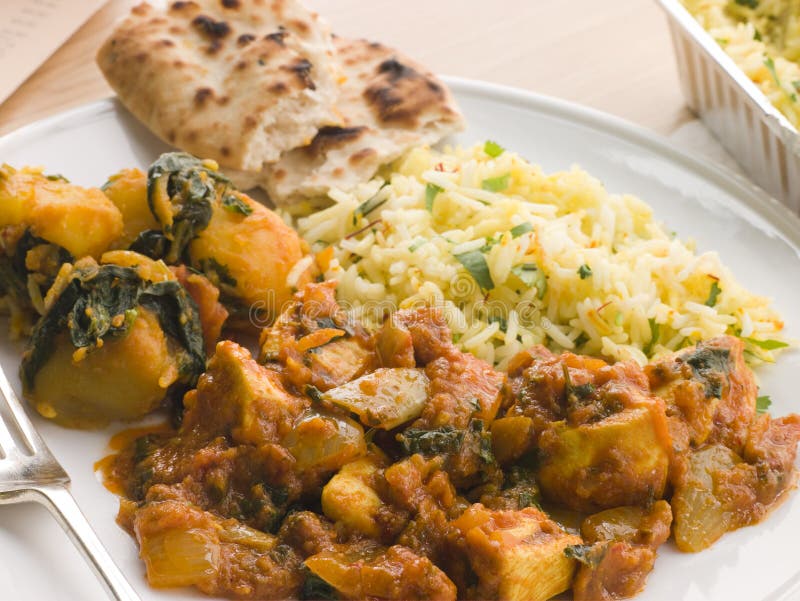 Chicken Bhoona, Sag Aloo and Pilau Rice Stock Photo - Image of away ...