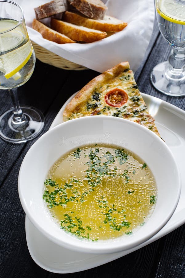 Chicken Broth with Kish Loren with Spinach and Ham. Stock Photo - Image ...