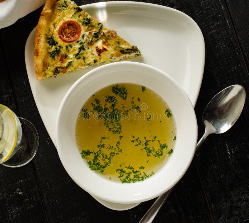 Chicken Broth with Kish Loren with Spinach and Ham. Stock Photo - Image ...