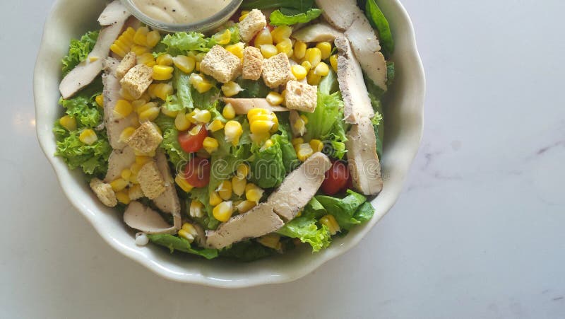 Chicken Caesar with Green Salad on White Marble Table Stock Photo ...