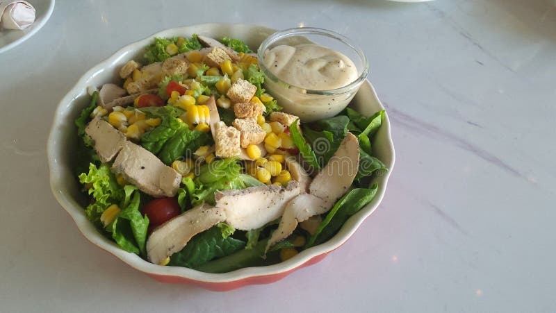 Chicken Caesar with Green Salad on White Marble Table Stock Photo ...