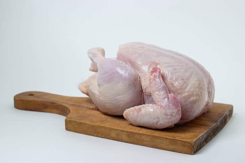 Chicken Carcass on a White Background. Chicken Meat on a Wooden Board ...