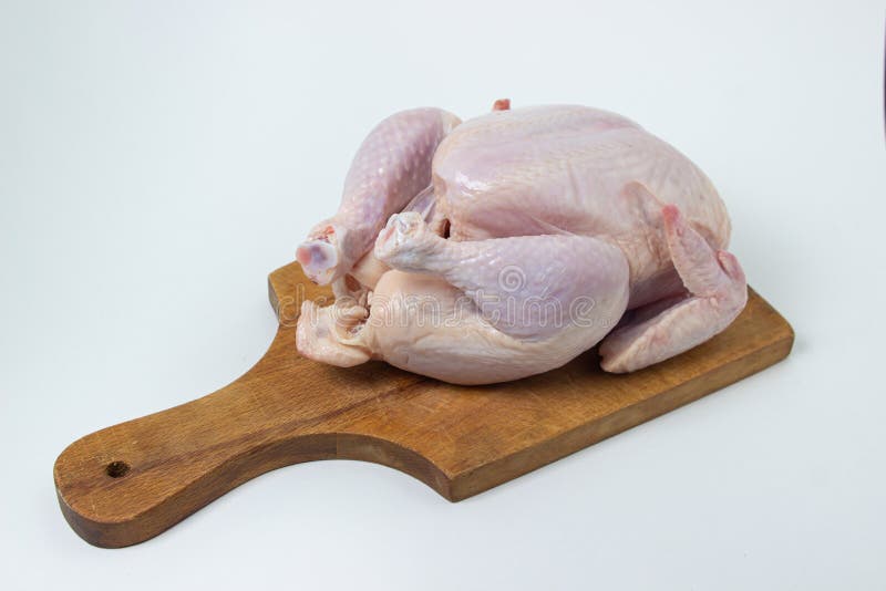 Chicken Carcass on a White Background. Chicken Meat on a Wooden Board ...