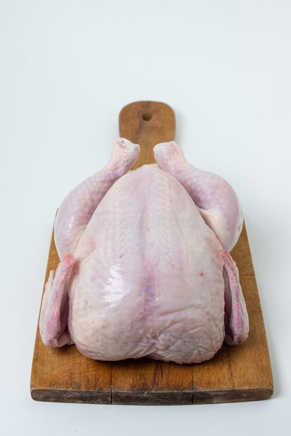 Chicken Carcass on a White Background. Chicken Meat on a Wooden Board ...