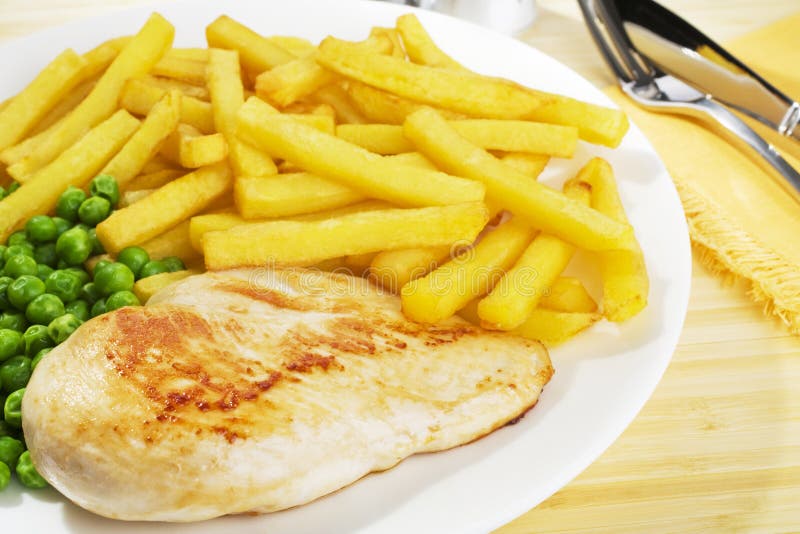Chicken and Chips Dinner stock image. Image of peas, panfried - 29146261