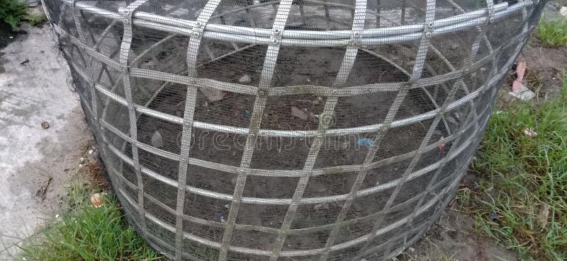 A Chicken Coop Made of Stainless Steel Covered with a Black Net Placed ...