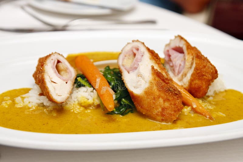 Chicken Cordon Bleu with Rice and Sauce Stock Image - Image of cooked ...