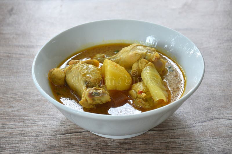 Chicken Drumsticks Massaman Curry with Slice Potato and Onion on Bowl ...