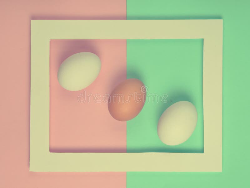 Chicken Eggs in a White Frame on a Colored Pastel Background. Mi Stock ...