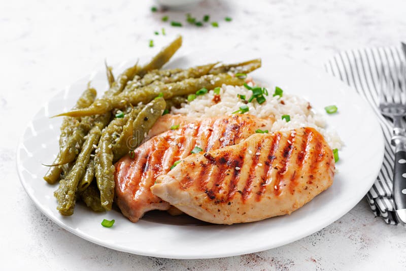 Chicken Fillet Cooked on a Grill and Garnish of Rice, Green Beans Stock ...