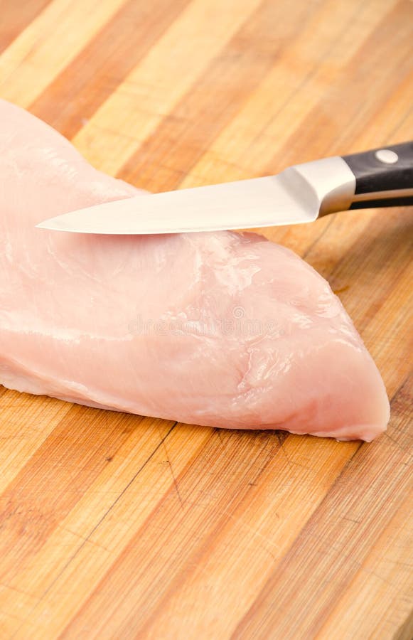 Chicken Fillet. Meat Ready for Cooking with Knife. Stock Photo - Image ...