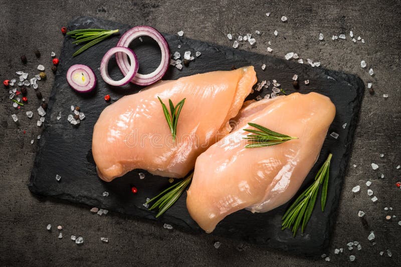 Chicken Fillet with Spices at Black Table. Stock Image - Image of ...