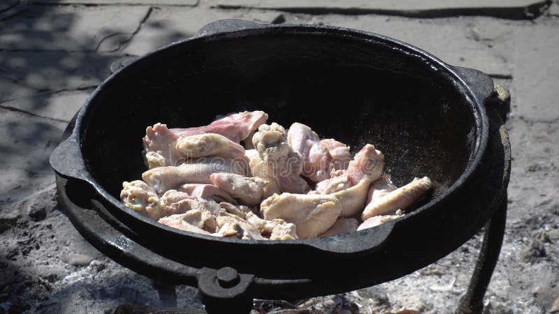 Chicken is Fried in a Cauldron, Over an Open Fire Stock Image - Image ...
