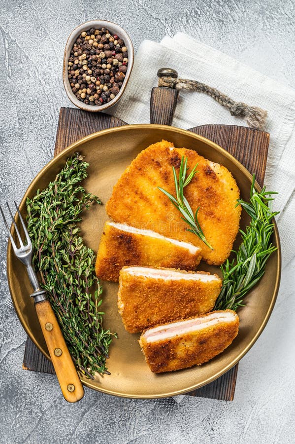 Chicken Fried Cordon Bleu Cutlet with Ham and Cheese on a Plate with ...