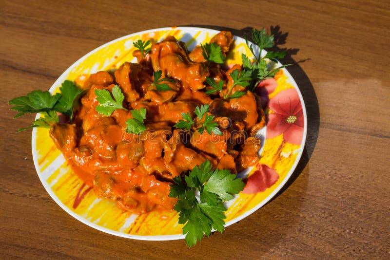 Chicken Gizzard Stew in Plate on Rustic Wooden Table Stock Image ...