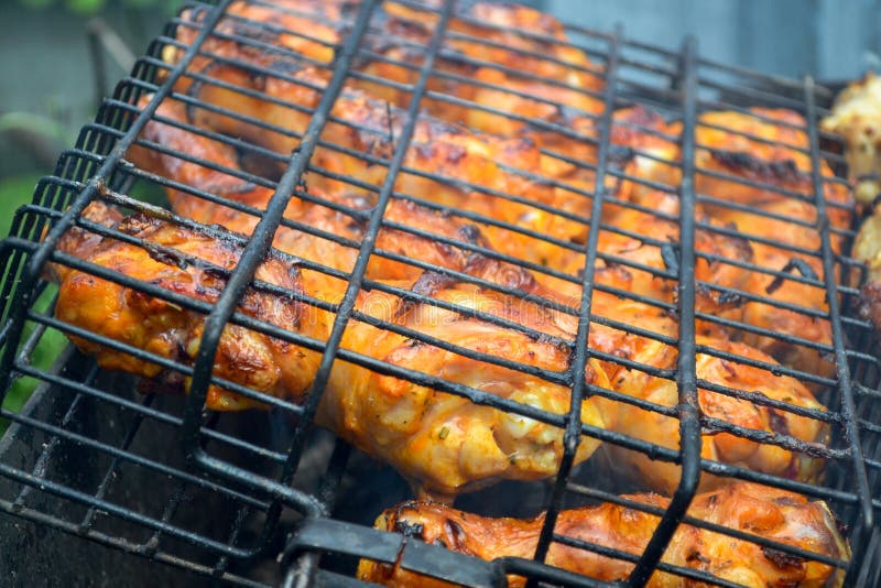 The Chicken is Grilled on Fire. Close-up Stock Image - Image of broiler ...