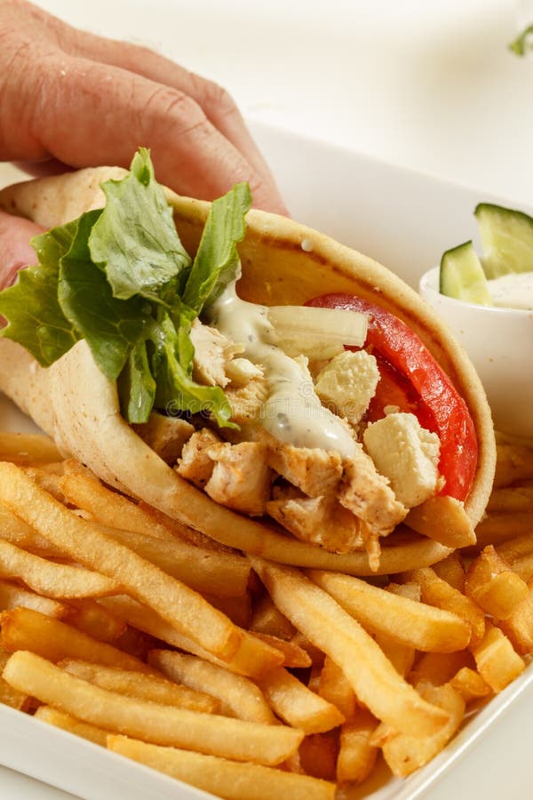 Chicken gyro stock image. Image of gyro, hand, holding - 97822513