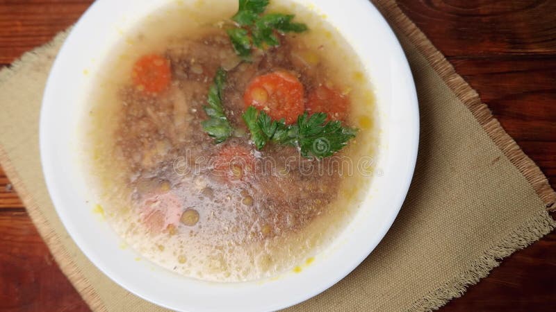 Chicken Jelly in the White Bowl on the Rustic Table Stock Footage ...