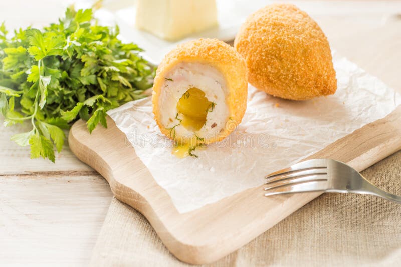 Chicken Kiev Cutlets with Parsley Leaves and Butter Stock Photo - Image ...