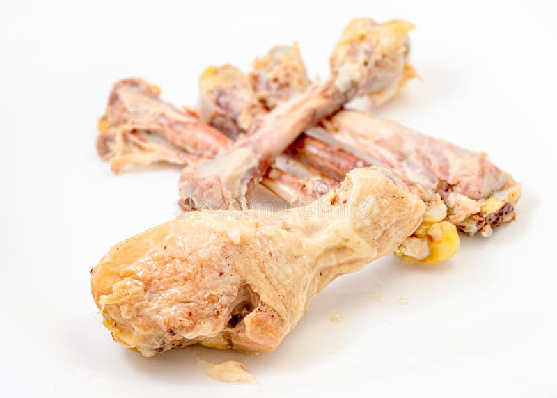 Chicken leg bone isolated stock photo. Image of meat - 214656670