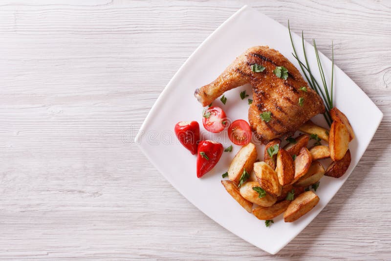 Chicken Leg and Chips on a Plate. Top View Horizontal Stock Photo ...