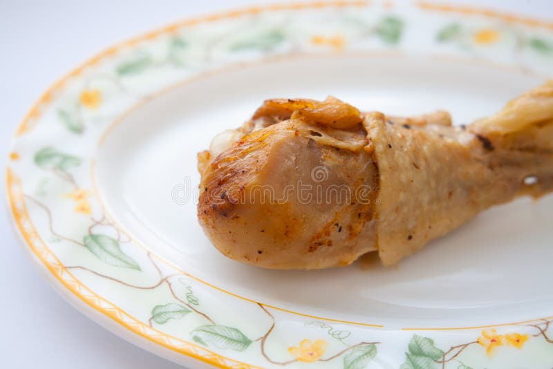 Chicken leg on a plate stock photo. Image of background - 51801570