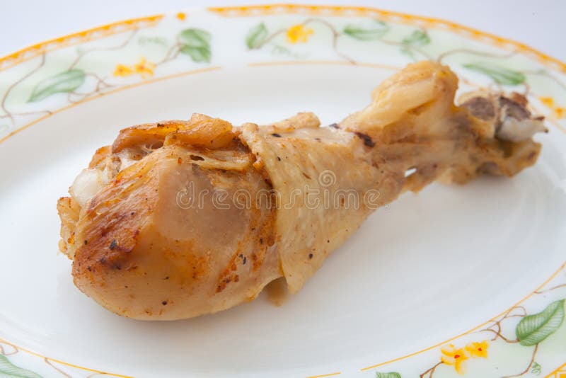 Chicken leg on a plate stock photo. Image of background - 51801570