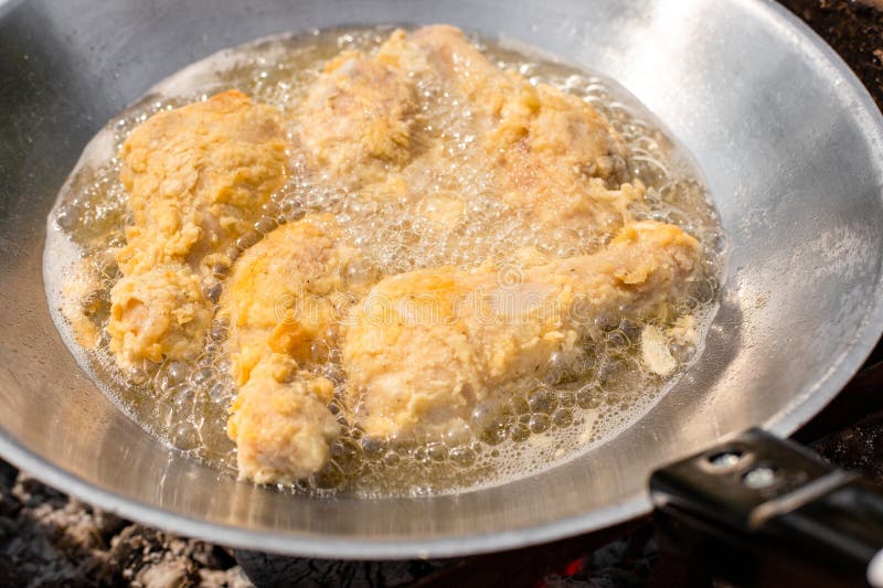 Chicken Legs in Batter are Fried in a Wok. Cooking Outside Stock Photo ...