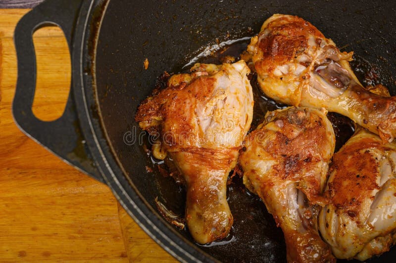 Chicken Legs Marinated with Spices are Fried in a Cauldron Stock Photo ...