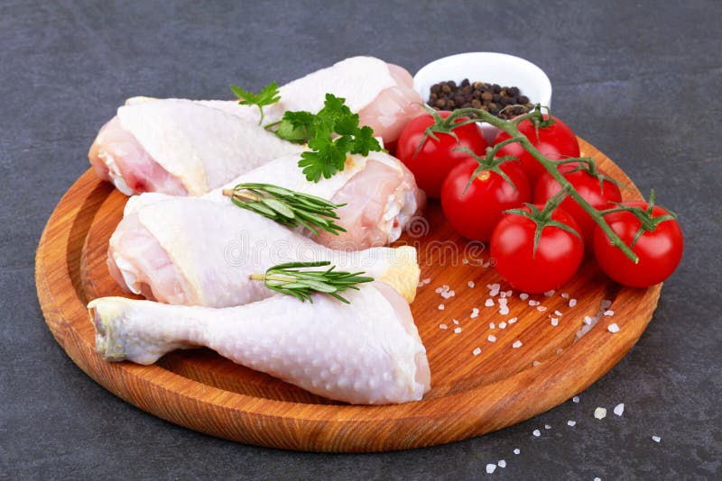Chicken legs on black stock photo. Image of kitchen - 284555248