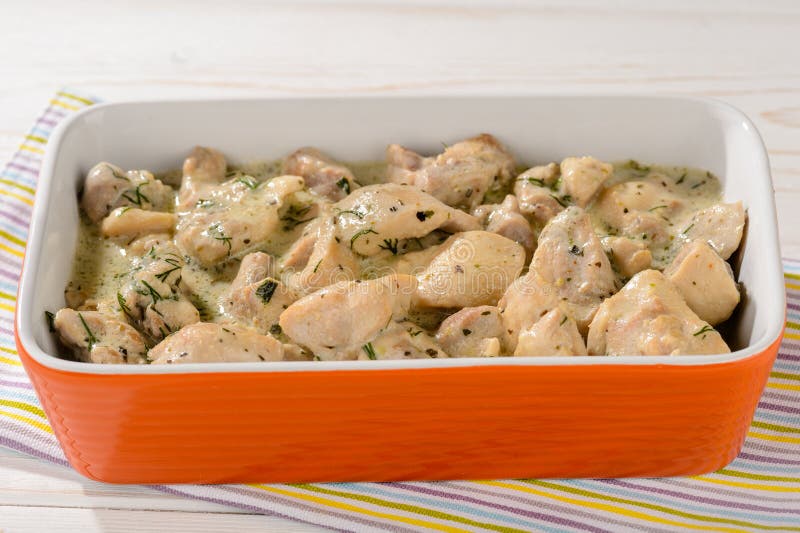 Chicken Meat Baked with Bechamel Sauce on Wooden Table. Stock Photo ...