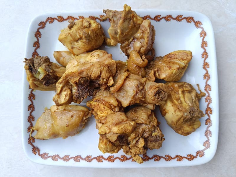 Chicken Meat Dish with Yellow Spices on a Plate. Chicken Meat. Stock ...