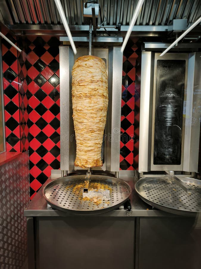 Chicken meat on a spit stock photo. Image of street - 303270322