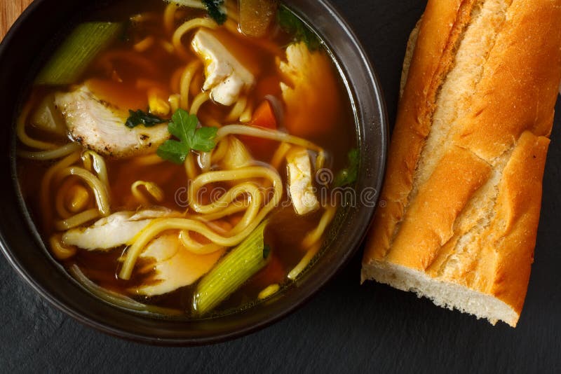 Homemade Chicken Vegetable Soup, Above Side Border on Rustic Wood Stock ...