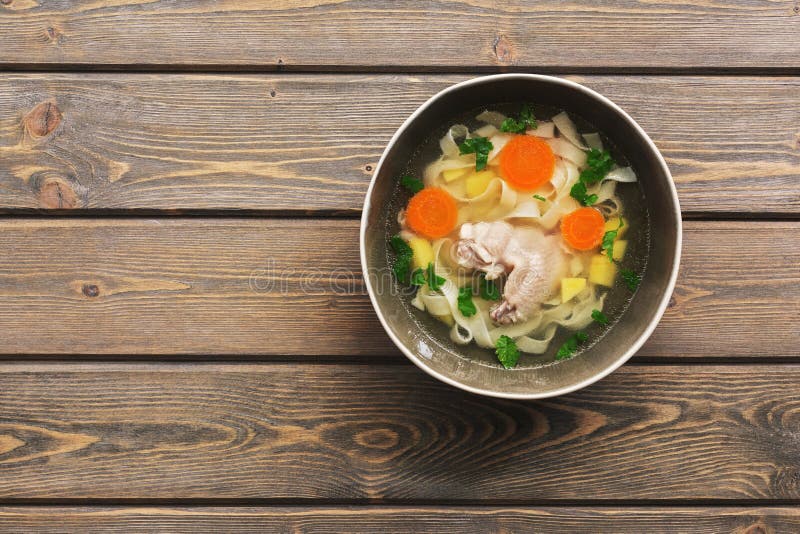 Chicken Noodle Soup on a Wooden Plank Table. Top View, Copy Space Stock ...