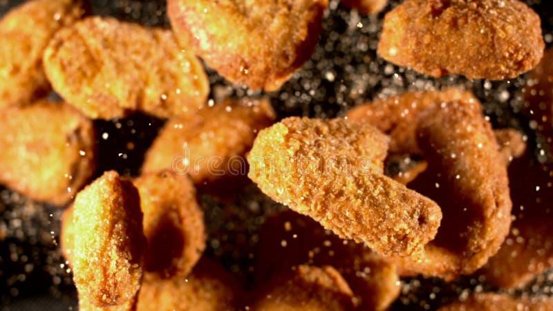 Chicken nuggets falling stock footage. Video of fresh - 207336480