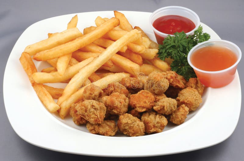 Chicken nuggets and fries stock photo. Image of fried - 2538172