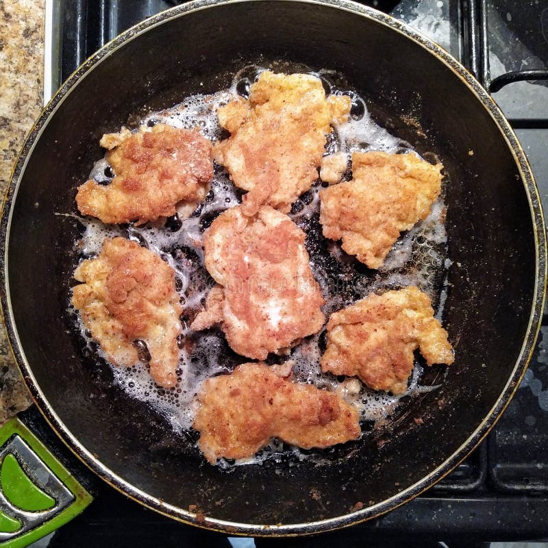 Chicken Nuggets Frying on Pan on Stove at Kitchen Stock Photo - Image ...