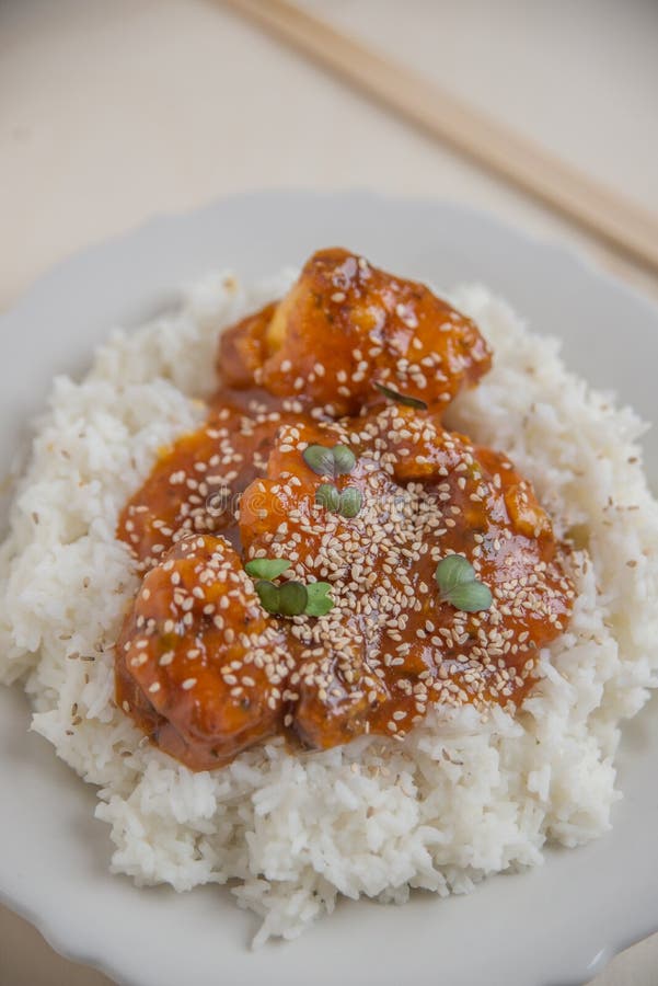 Chicken with Orange Sauce and Rice in a Bowl Stock Photo - Image of ...