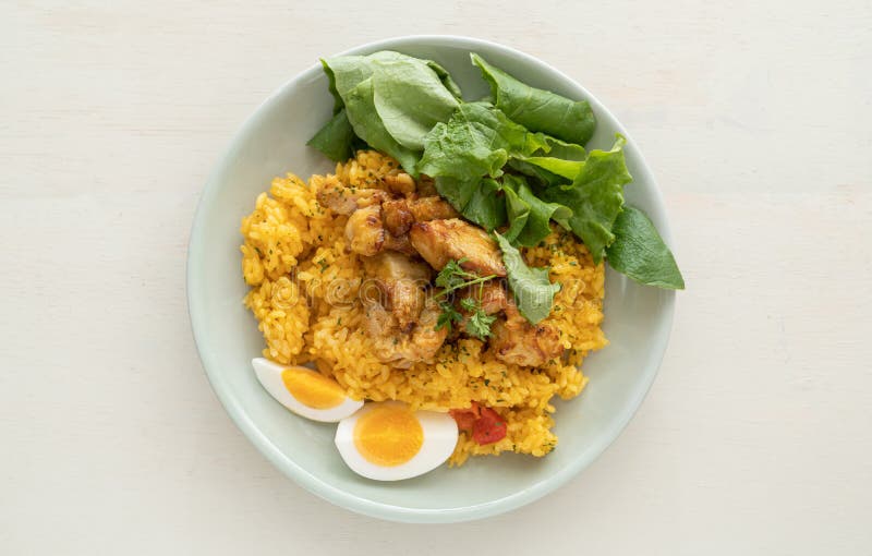 Chicken Paella Rice with Boiled Egg and Salad Stock Photo - Image of ...