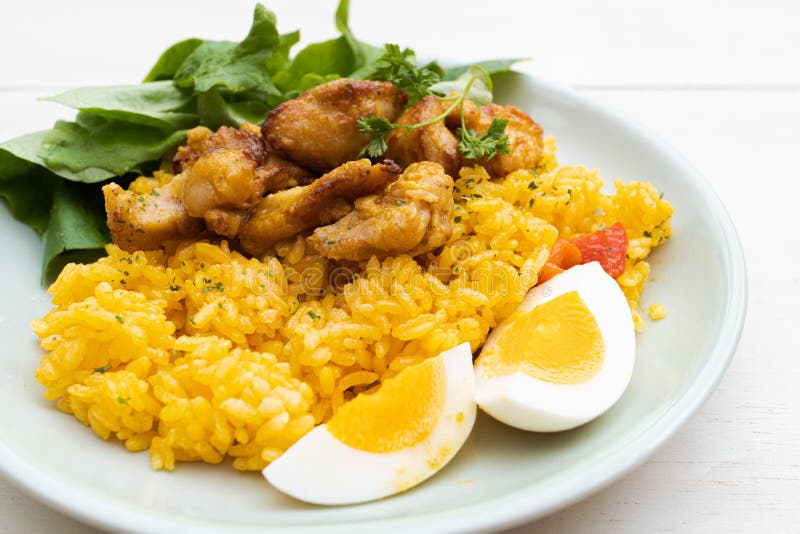 Chicken Paella Rice with Boiled Egg and Salad Stock Photo - Image of ...