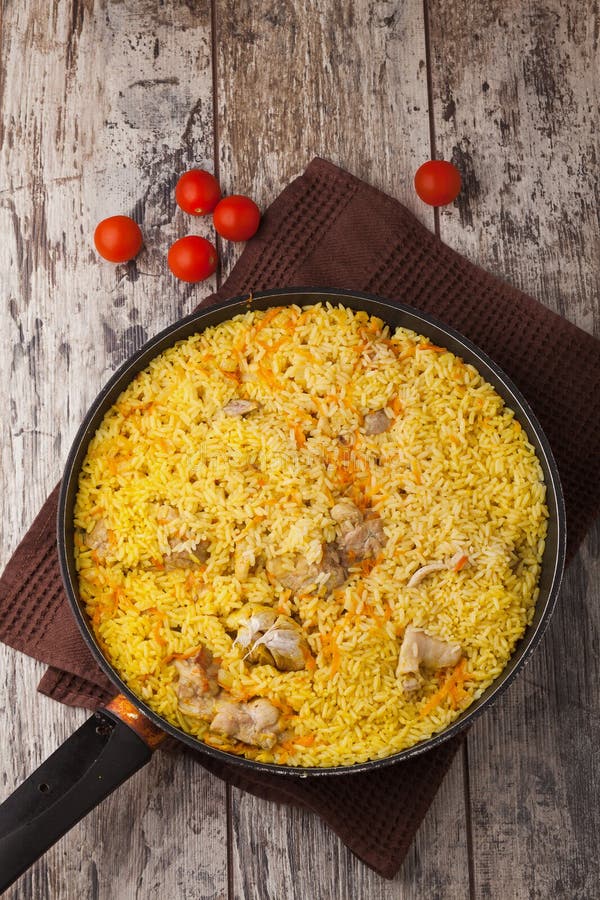 Chicken Pilaf in a Frying Pan on Wood Table Stock Image - Image of ...