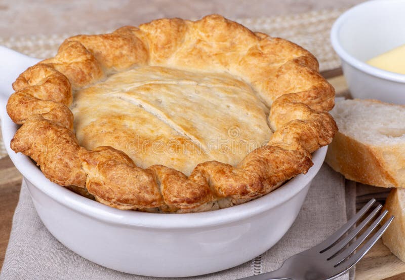 Chicken Pot Pie with Golden Crust Stock Photo - Image of white, fork ...