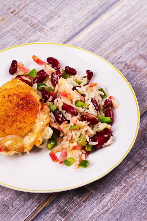 Chicken with Rice, Beans, Bacon and Green Pepper in Pan Stock Image ...