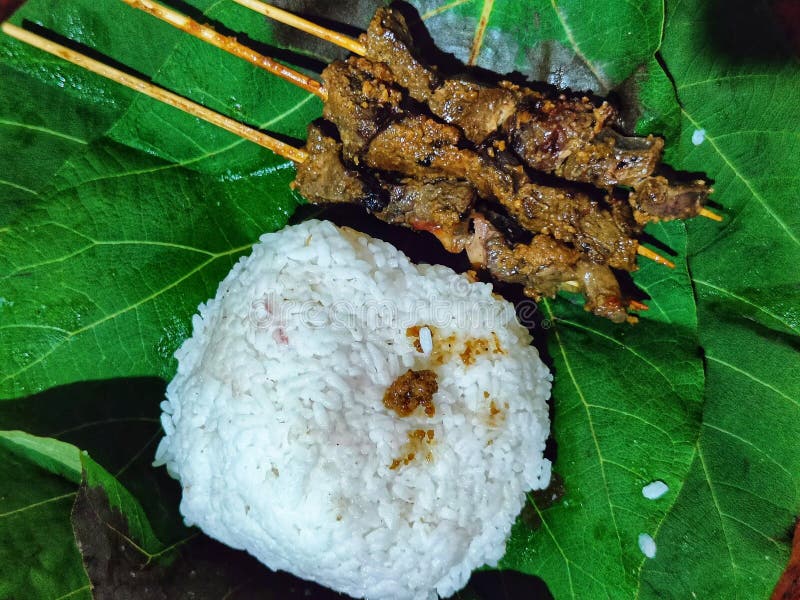 Chicken Satay with White Rice on a Leaf Plate Stock Photo - Image of ...