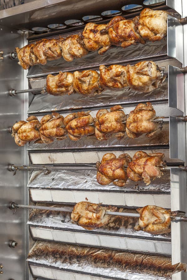 Chicken on spit roaster stock image. Image of tasty, spit - 95684493