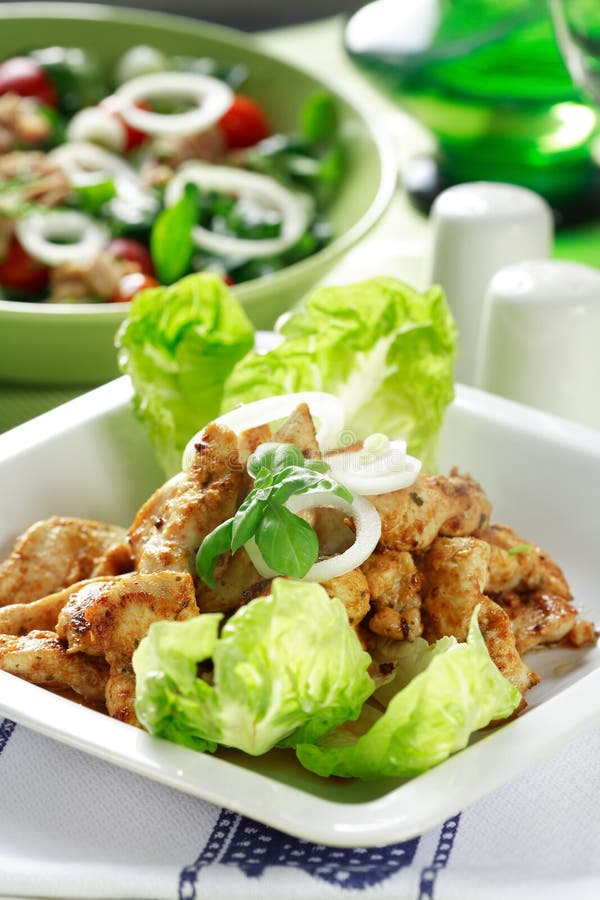 Chicken stripes with salad stock image. Image of plate - 2039107