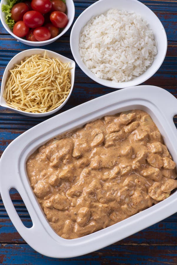 Chicken Stroganoff Accompanied with Rice, Salad and Potato Straw Stock ...